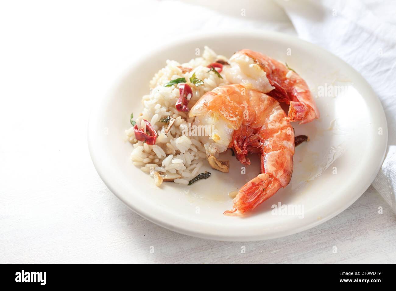 Fried tiger prawns or shrimps and rice spiced with garlic, red chili ...