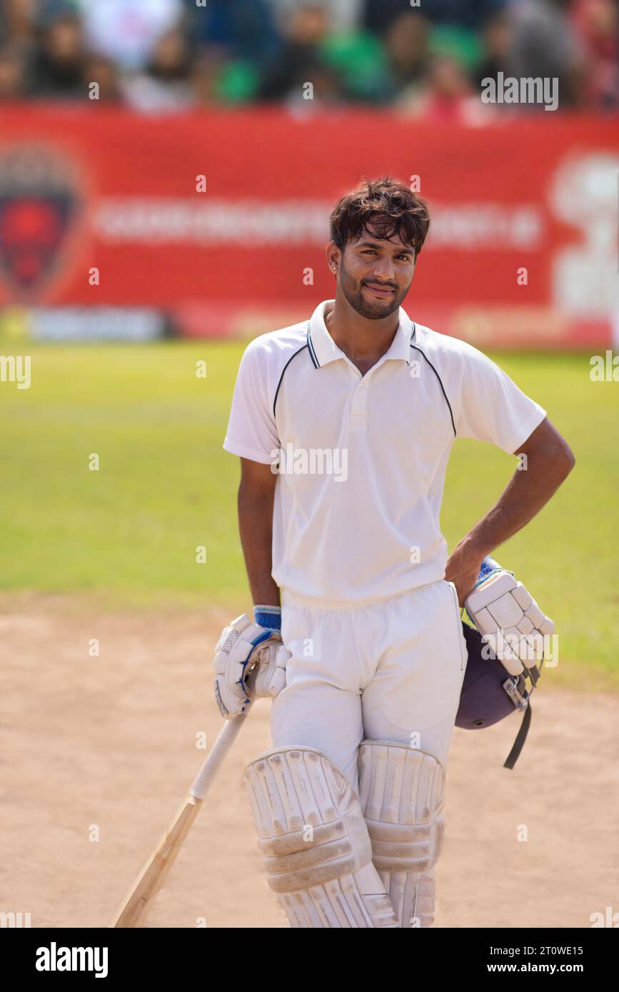 Cricket player holding cricket bat hi-res stock photography and images ...
