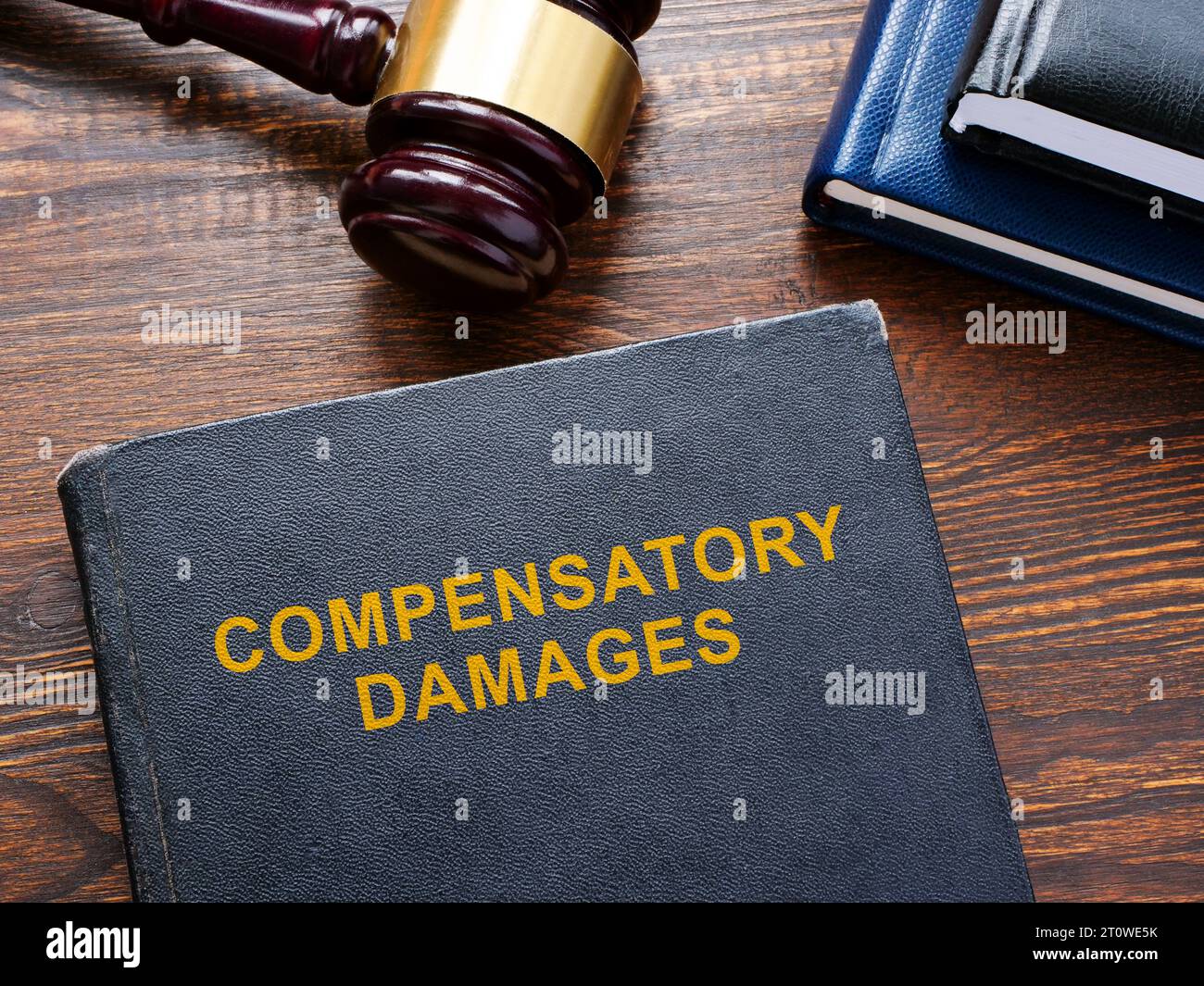 Compensatory damages law and wooden gavel Stock Photo - Alamy