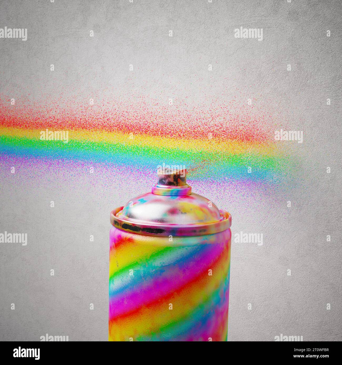 A graffiti spray can creates a vibrant rainbow line on a wall. Urban ...