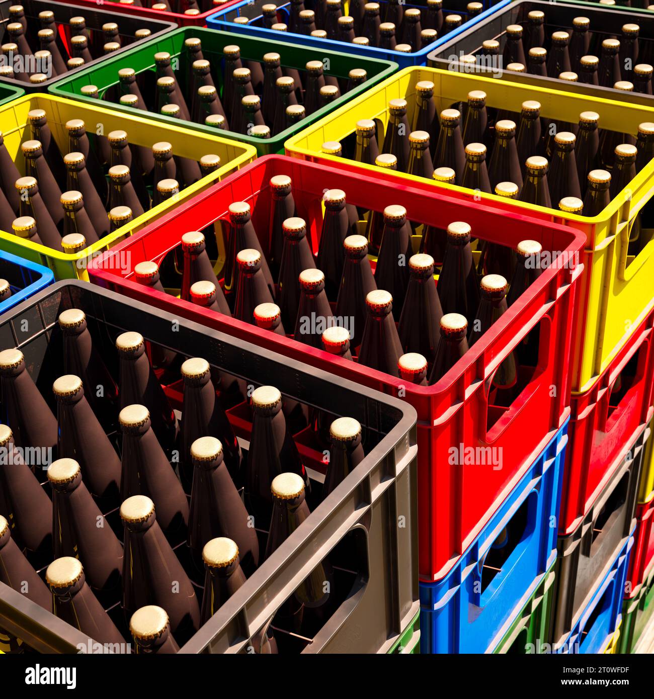 Countless colorful beer crates full of bottles stacked in an outdoor ...