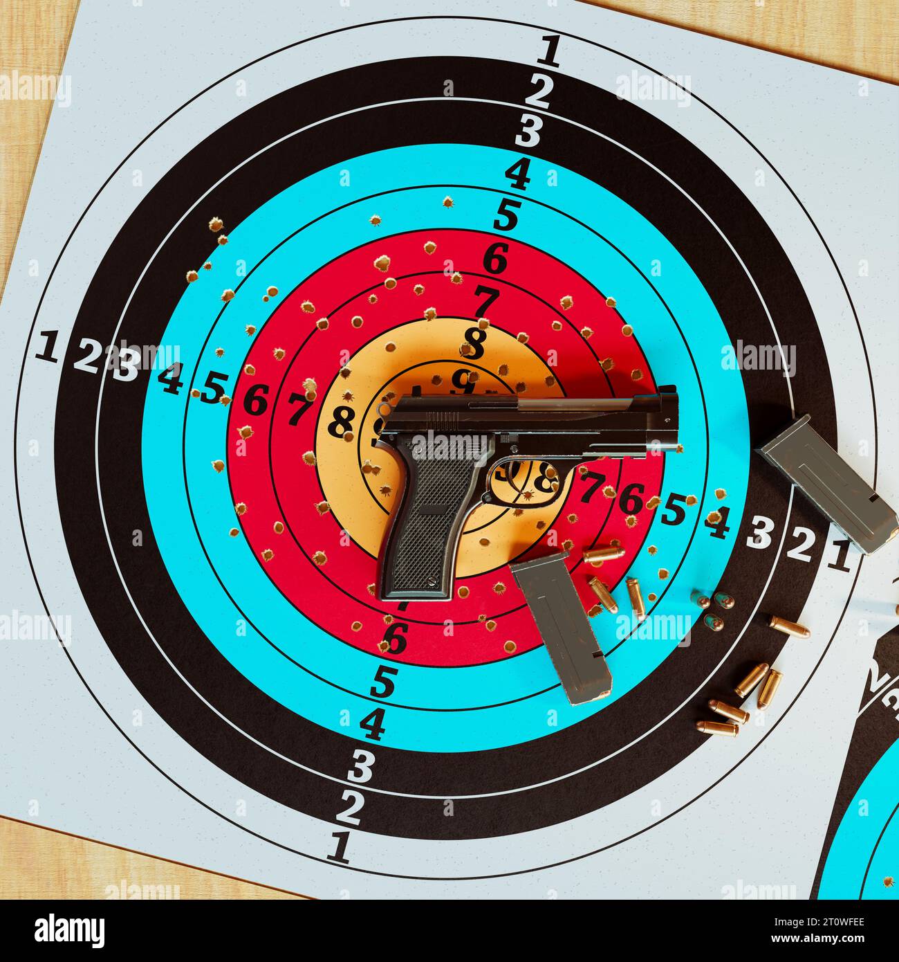 Gun and ammo on the shooting target. 9mm pistol with bullets and ...