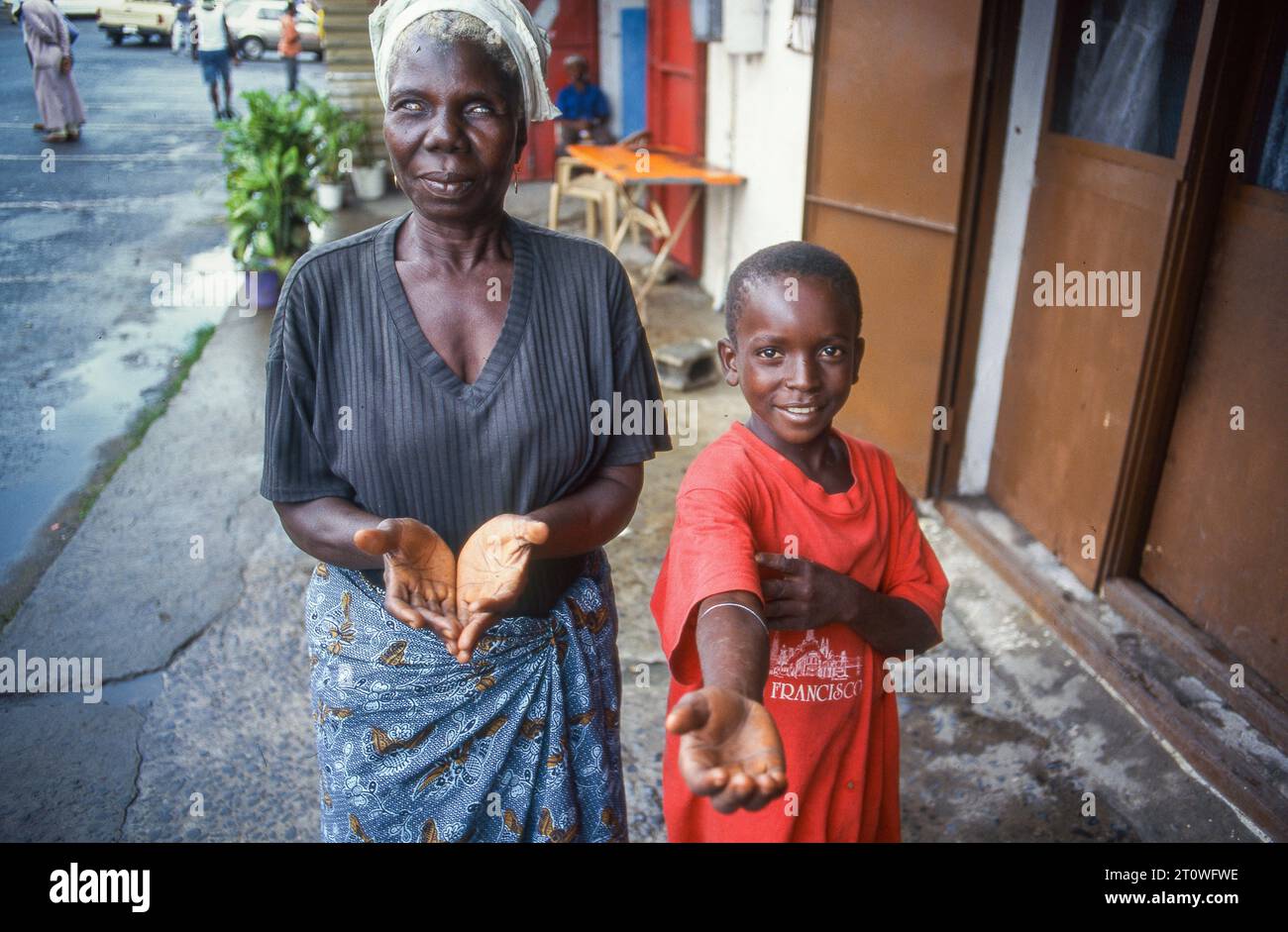 Liberia, boy with blind mother begging in streets of Monrovia Stock ...