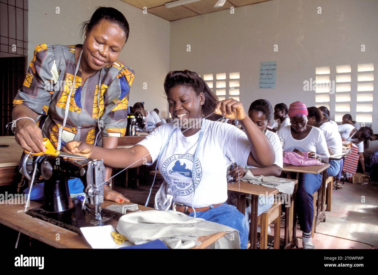 Liberia, Monrovia; Sewing class. After the civil war, these female ex ...