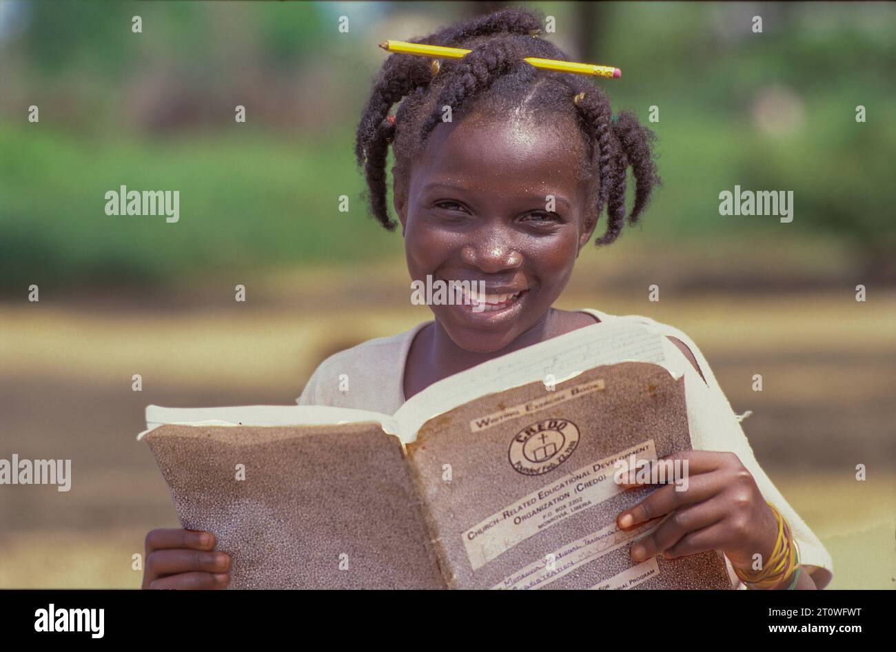 Liberia, Monrovia - portrait of a schoolgirl holding a textbook Stock ...