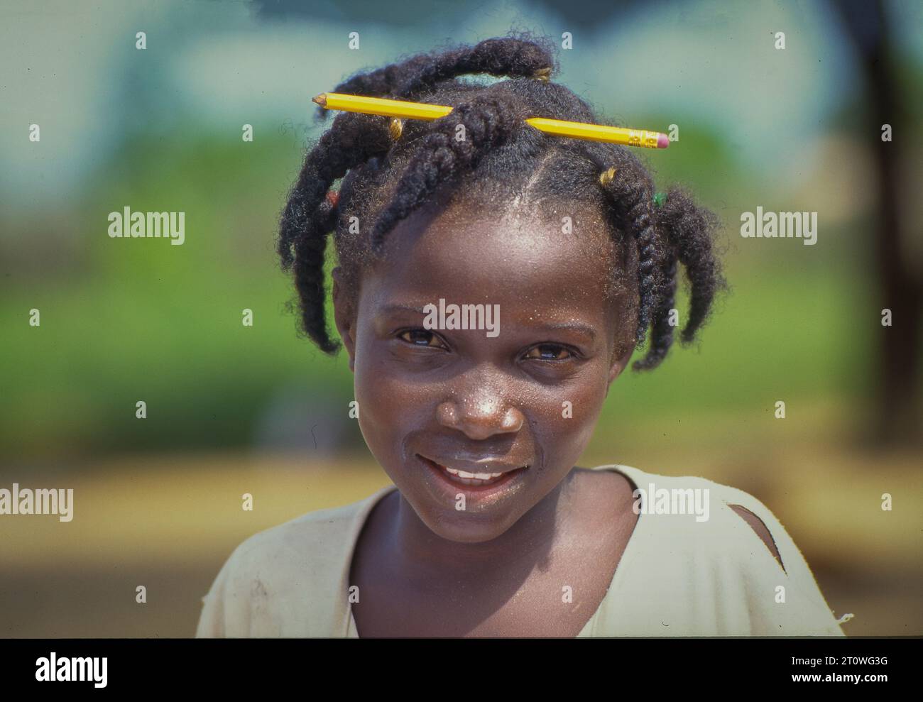 Liberia, Monrovia - portrait of a schoolgirl holding a textbook Stock ...