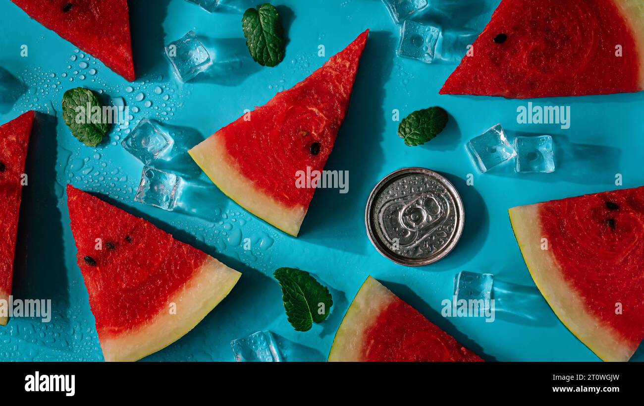 Creative summer composition with watermelon, mint leaves, can of soda ...