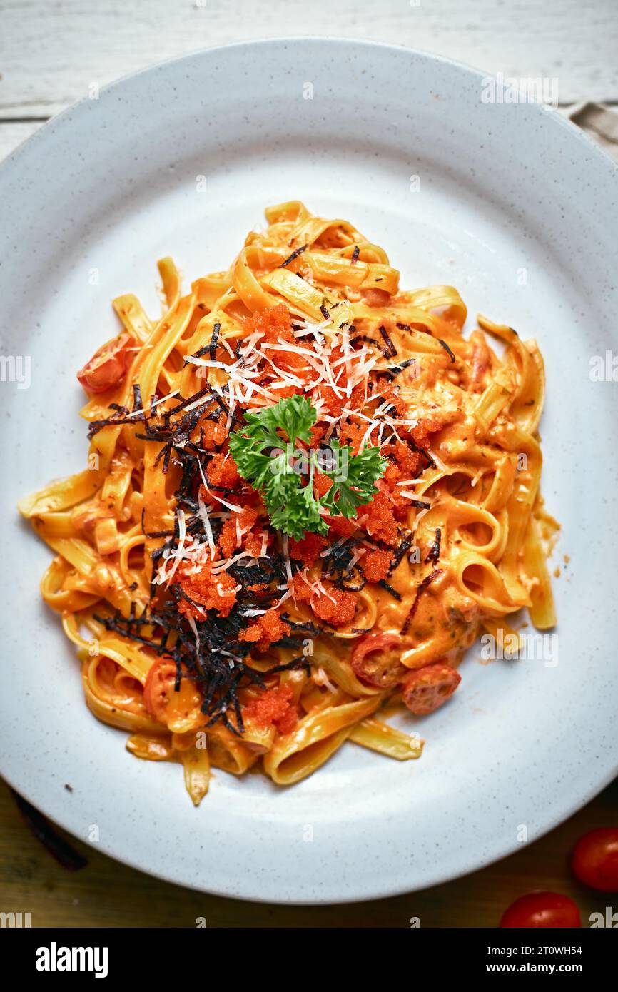 creamy sauce pasta with ebiko , selective focus Stock Photo - Alamy