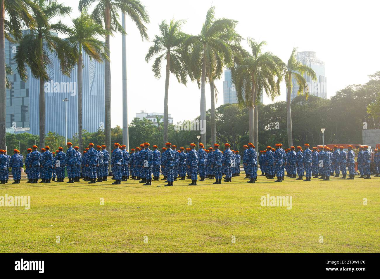 Indonesian Air Force military troops are lining up neatly in a park ...