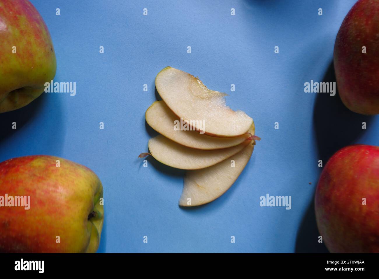 A split apple with a blue background, a perfect photo for a food ...