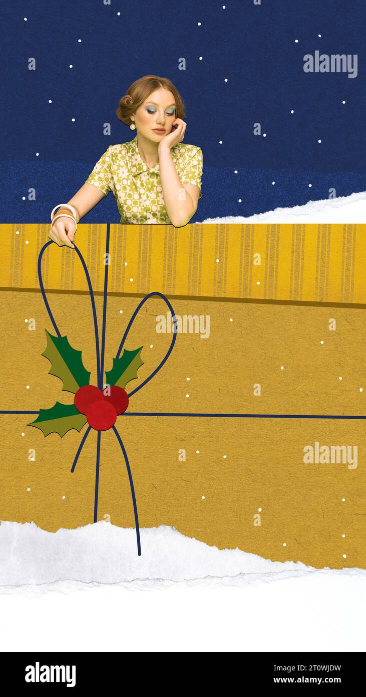 Beautiful young woman with makeup and hairstyle opening giant Christmas ...