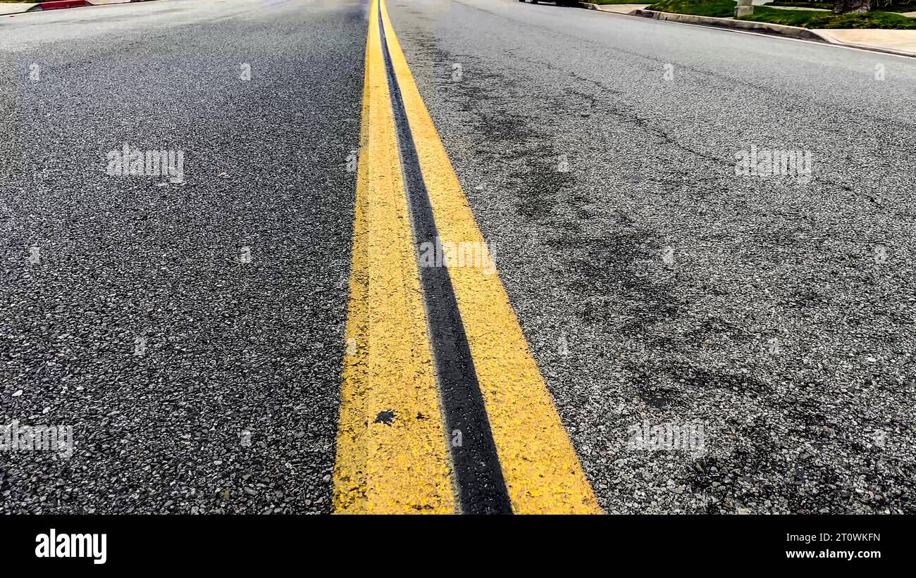 The dividing line of a roadway that divides the highway where vehicles ...