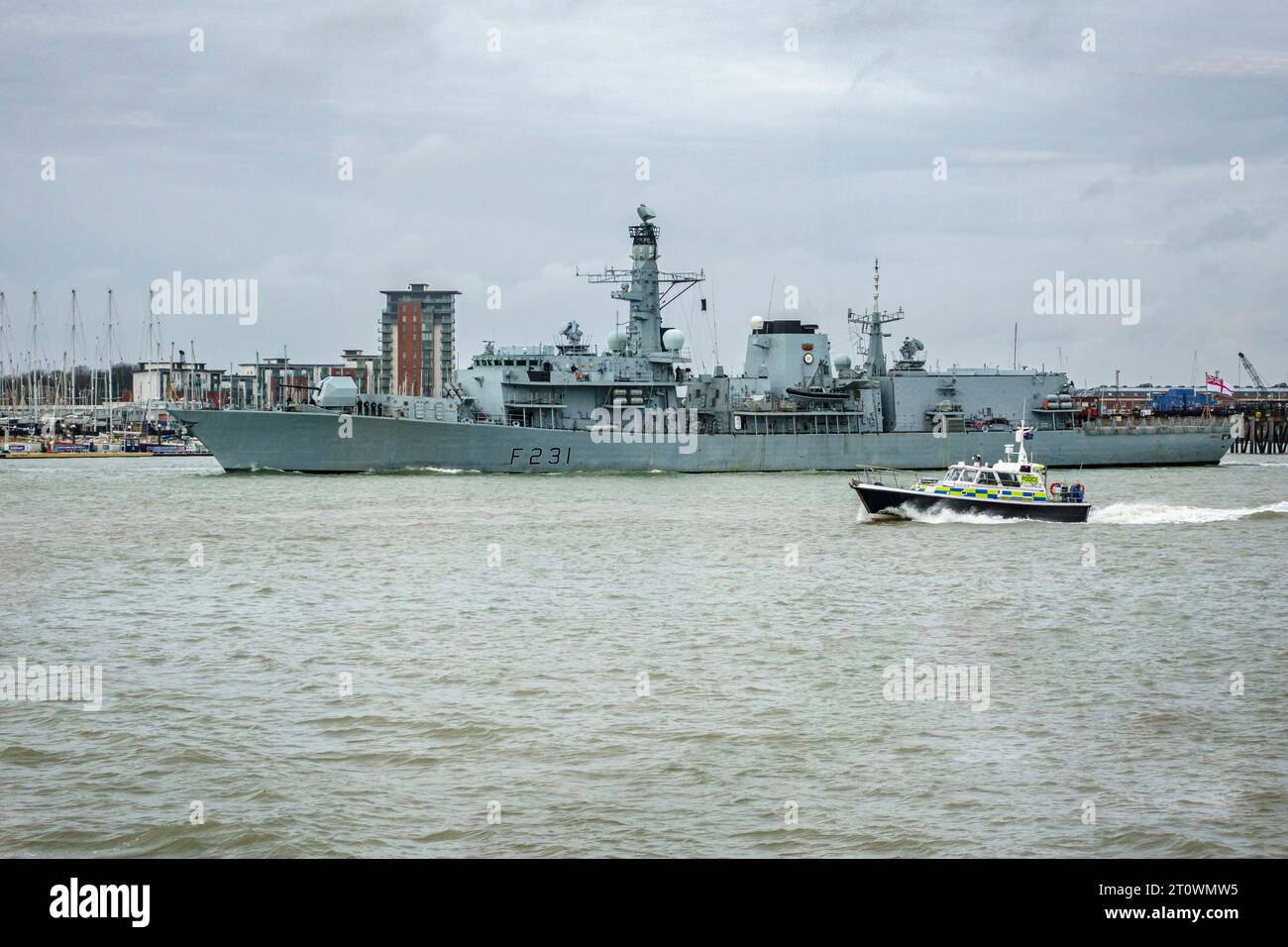 HMS Argyll, a Type 23 frigate of the Royal Navy, escorted by a police ...