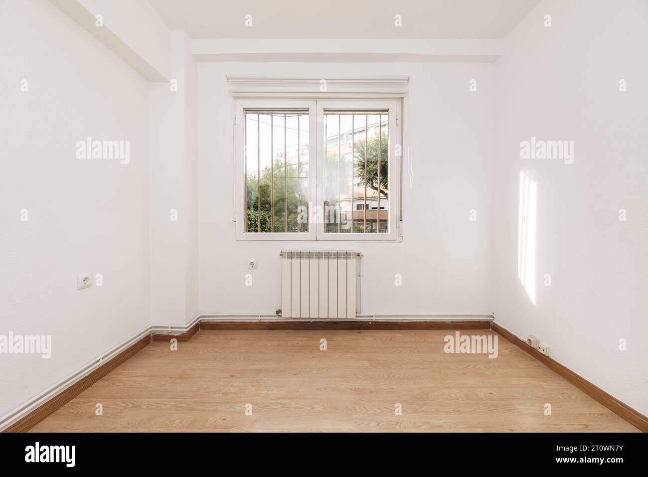 Empty room with aluminum window with bars Stock Photo - Alamy