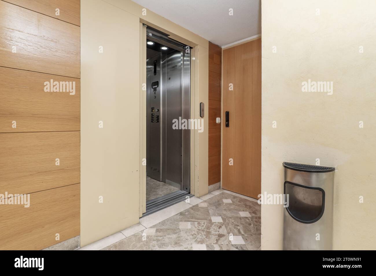 Elevator lined with stainless steel on the ground floor Stock Photo - Alamy