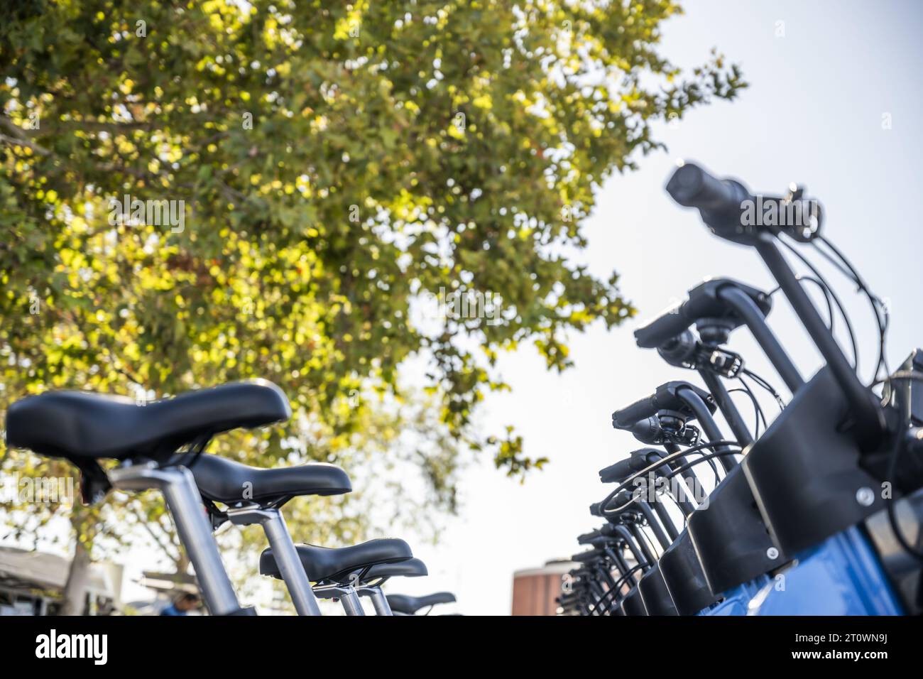 A row of urban electric bicycles Stock Photo - Alamy
