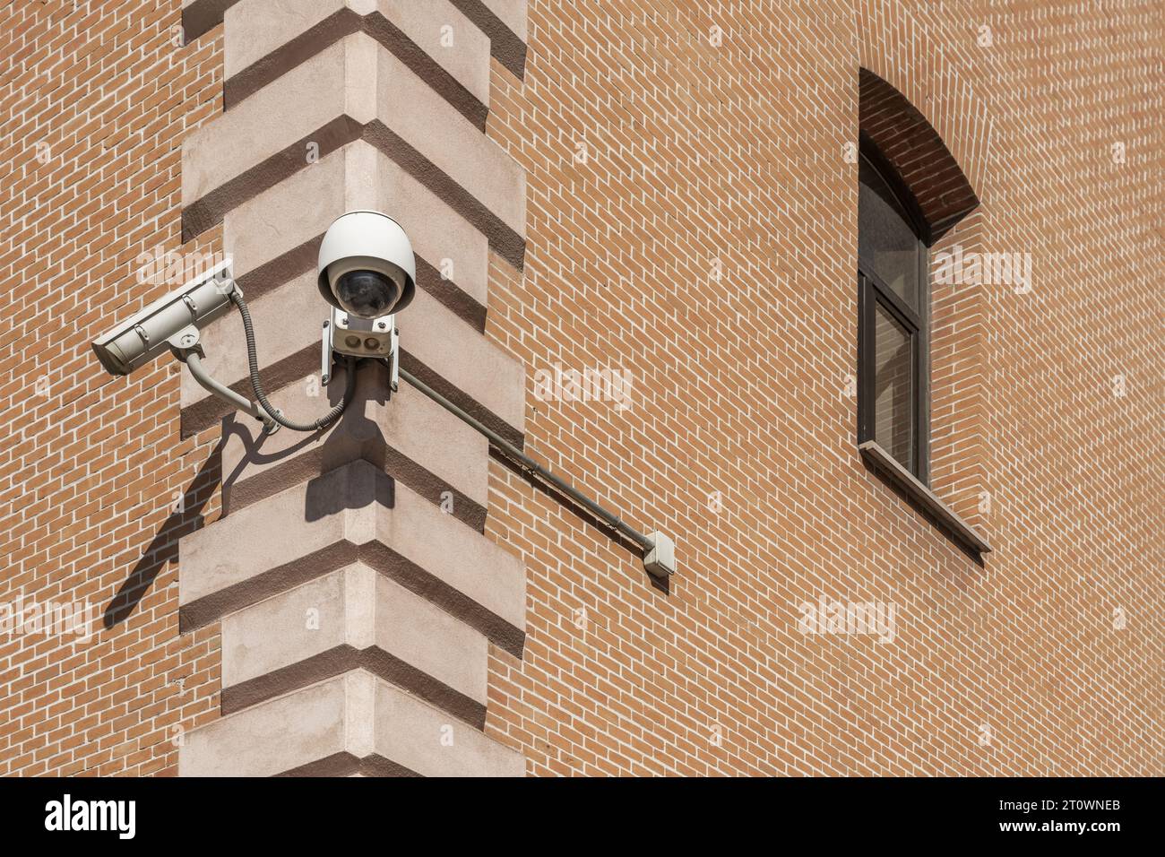 Surveillance cameras attached to a corner Stock Photo - Alamy