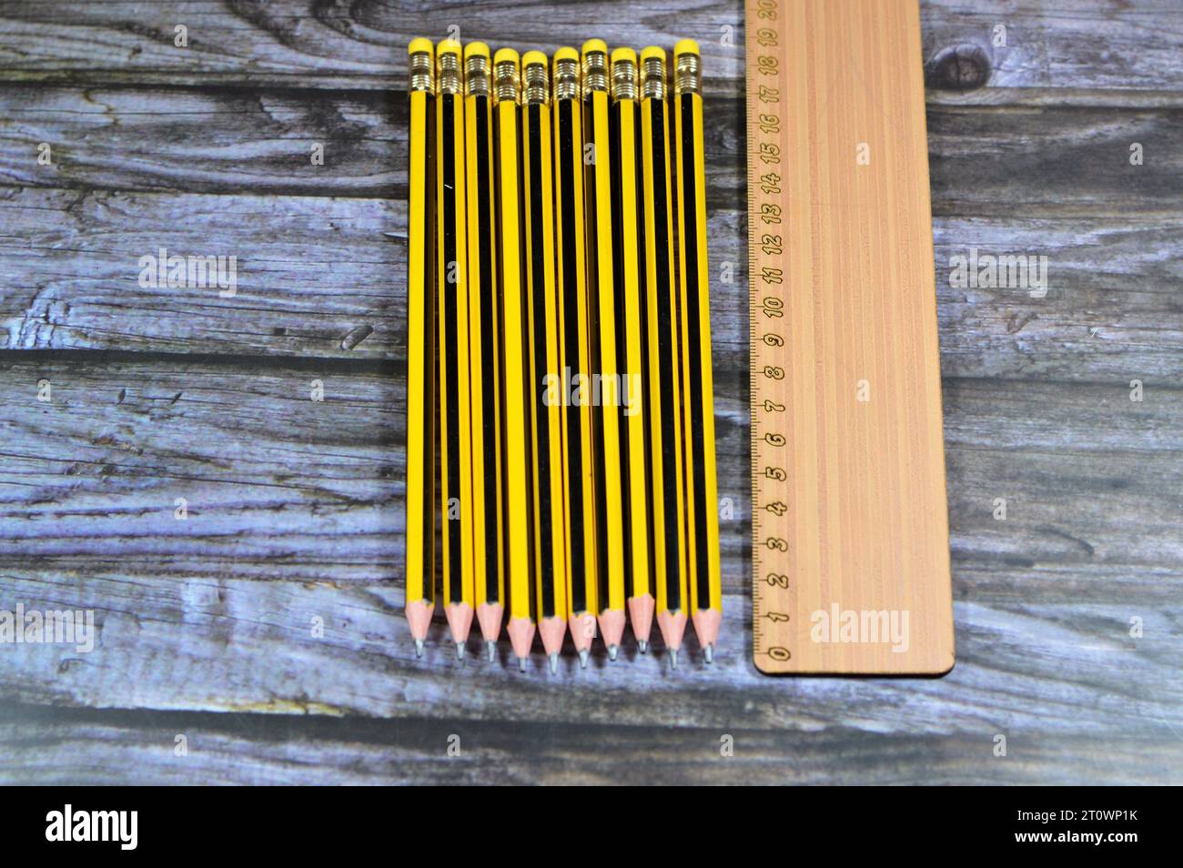 A ruler, rule, line gauge for length measurement and Row of pencils, a ...