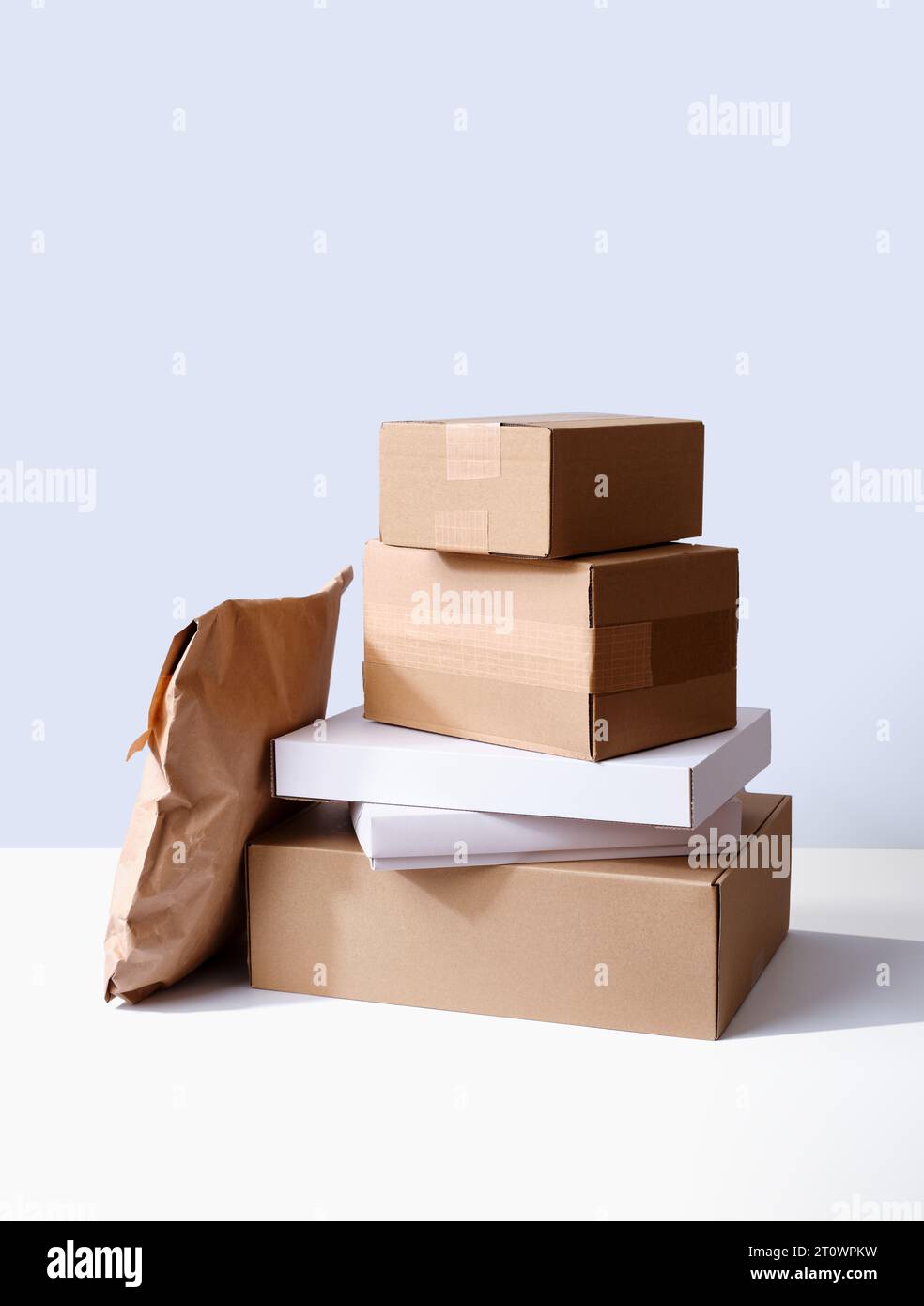 Stack of cardboard parcels Stock Photo - Alamy