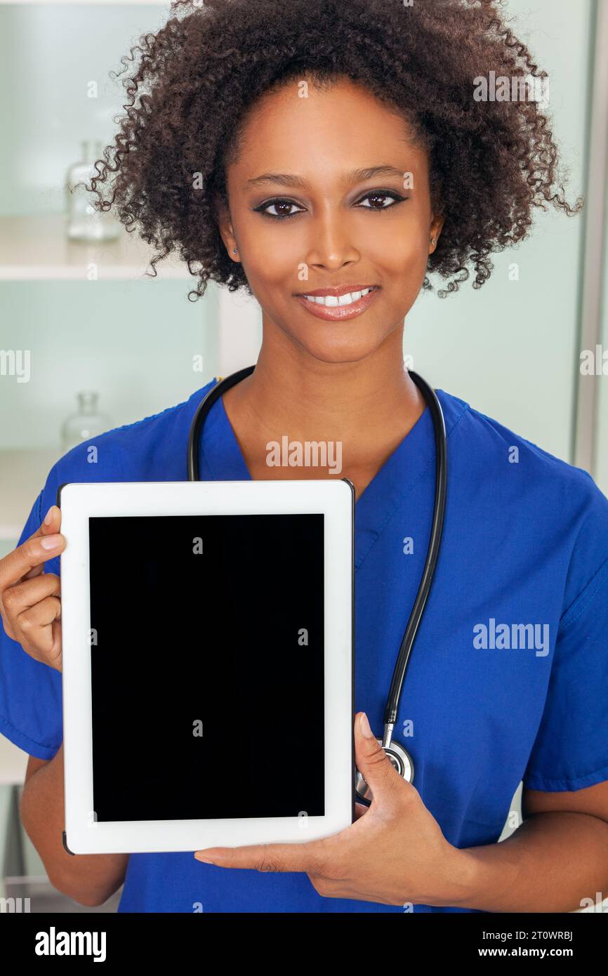 Black African American female medical doctor holding a blank tablet ...