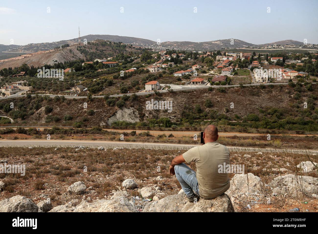 09 October 2023, Lebanon, Khiam: A Lebanese man takes video footages of ...