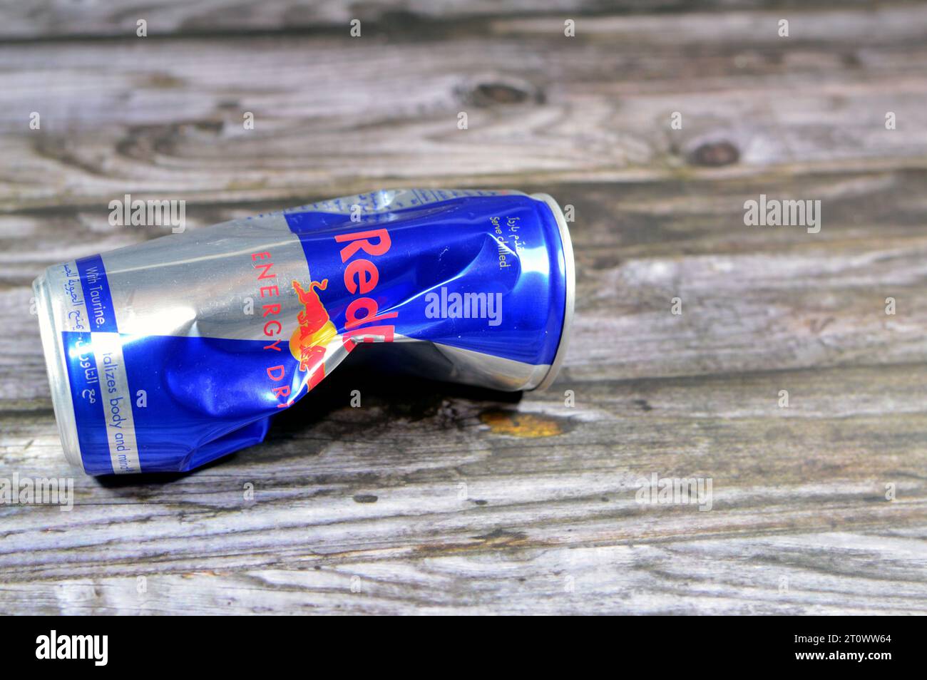 Cairo, Egypt, October 1 2023: Crushed dented Red Bull energy drink, a ...
