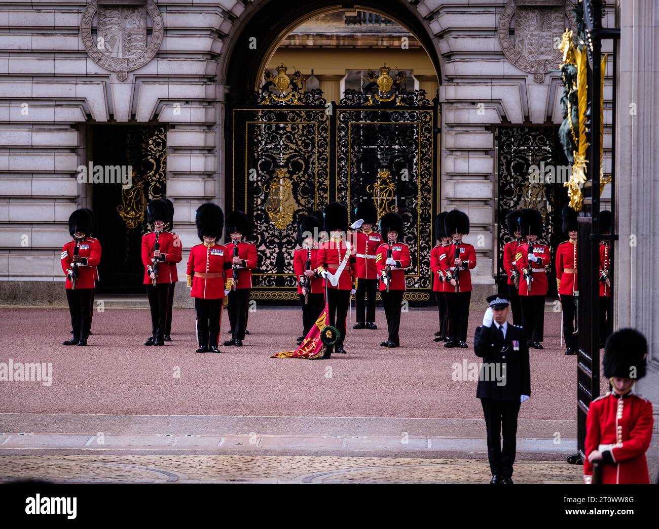The kings troop lower the standard in front of the palace as the ...
