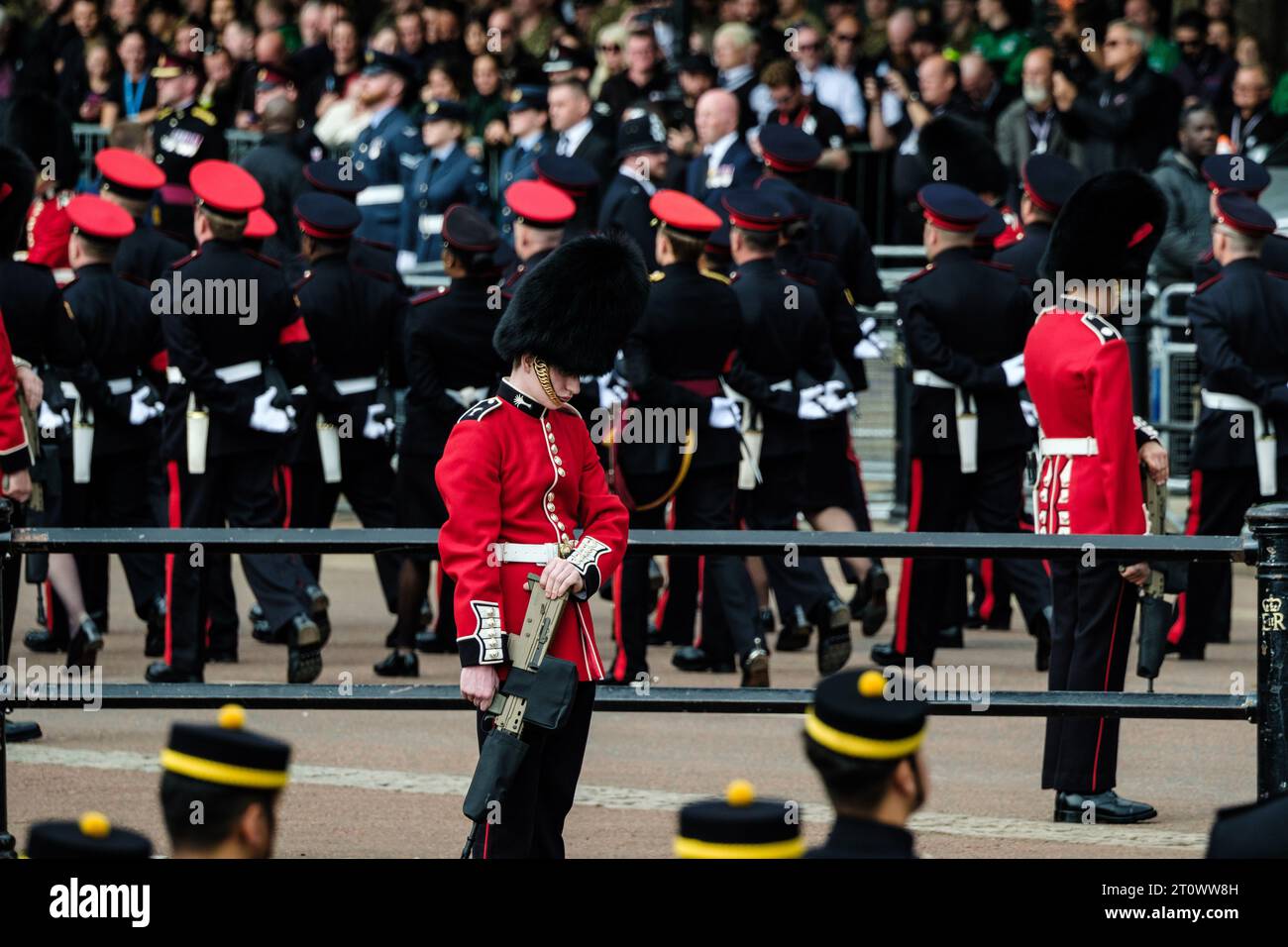 A young Welsh Guardsman outside the palace bows his head as the funeral ...