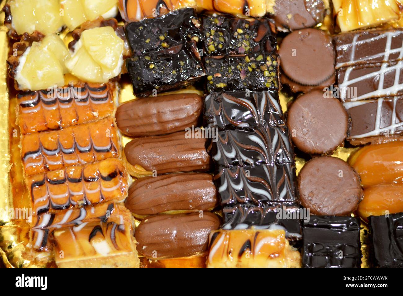 Assorted mini small gateau pieces with various toppings and stuffed ...