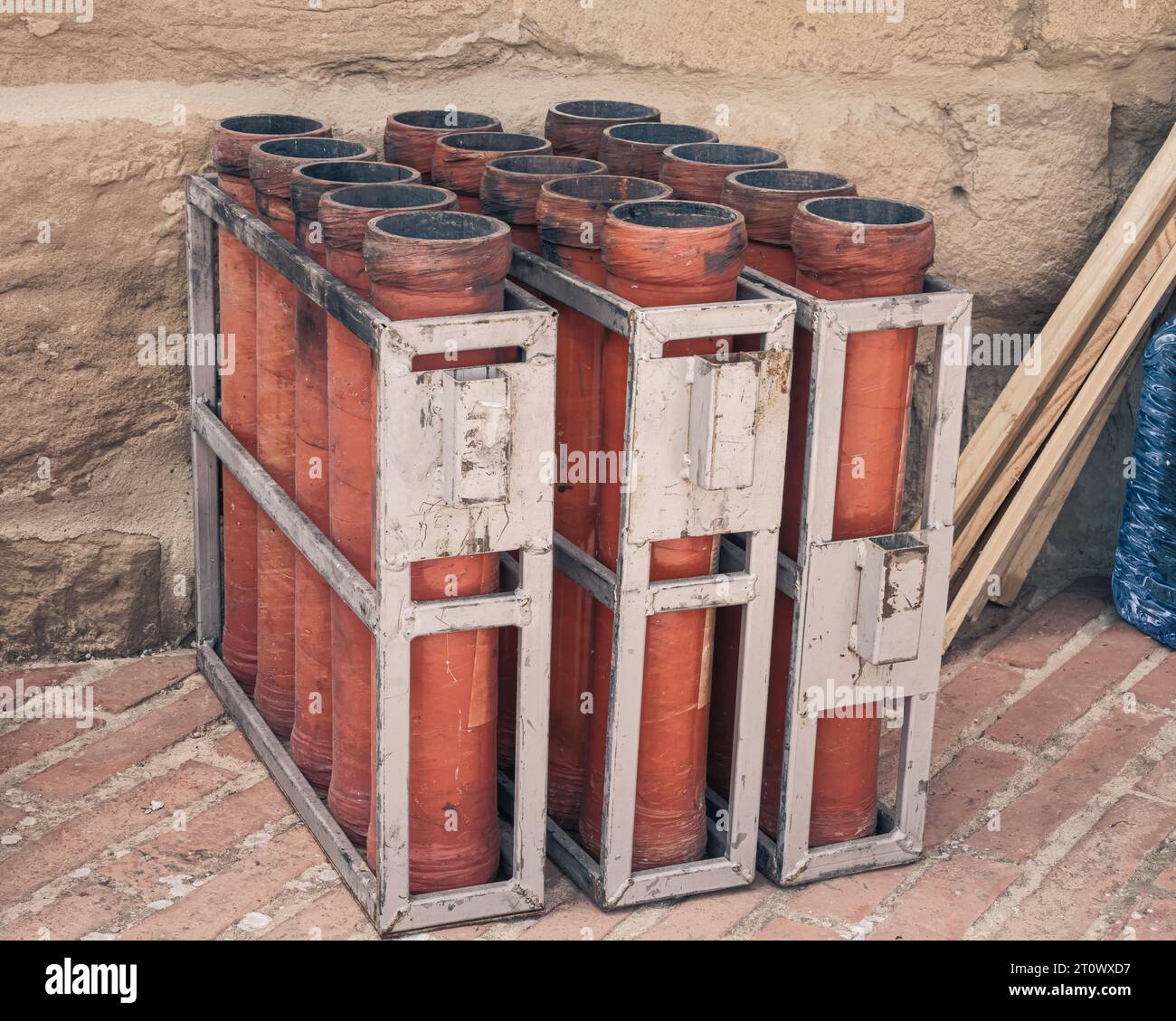 Containers with tubes and pipes laid on ground to light firework show ...
