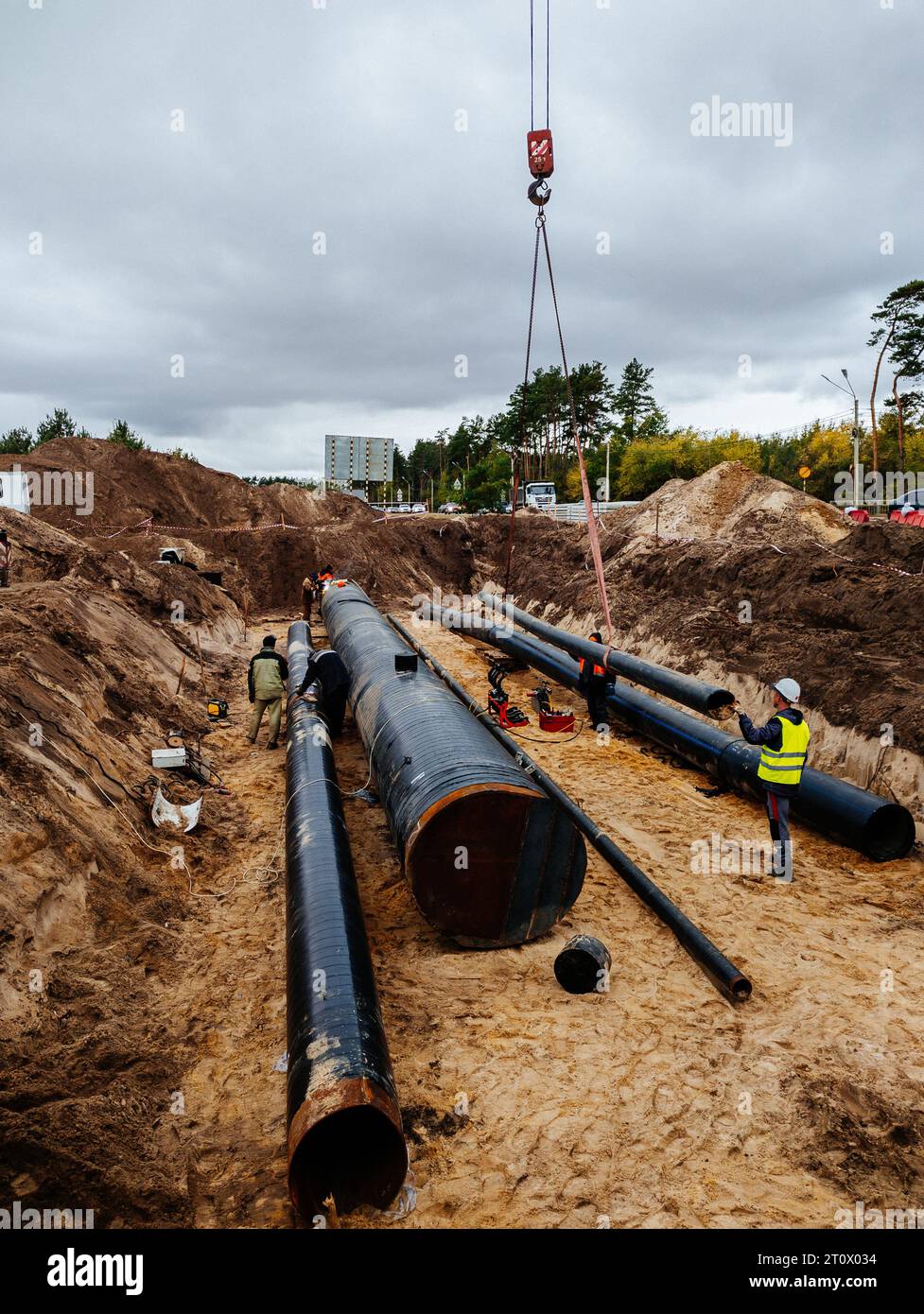 Process of laying and joining of water supply or sewer pipes. Lifting ...