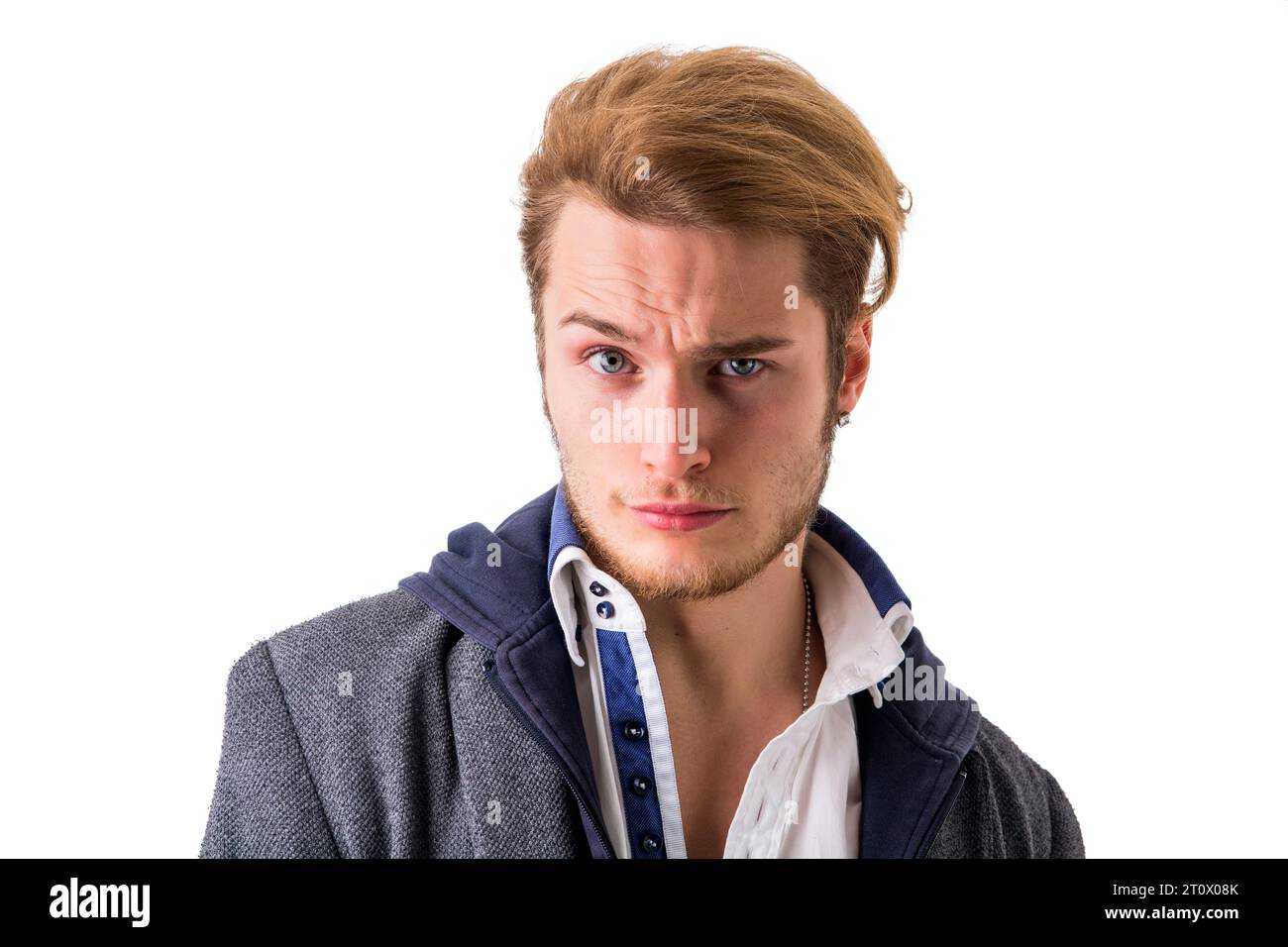 A young man with a concerned look on his face. Photo of a worried young ...