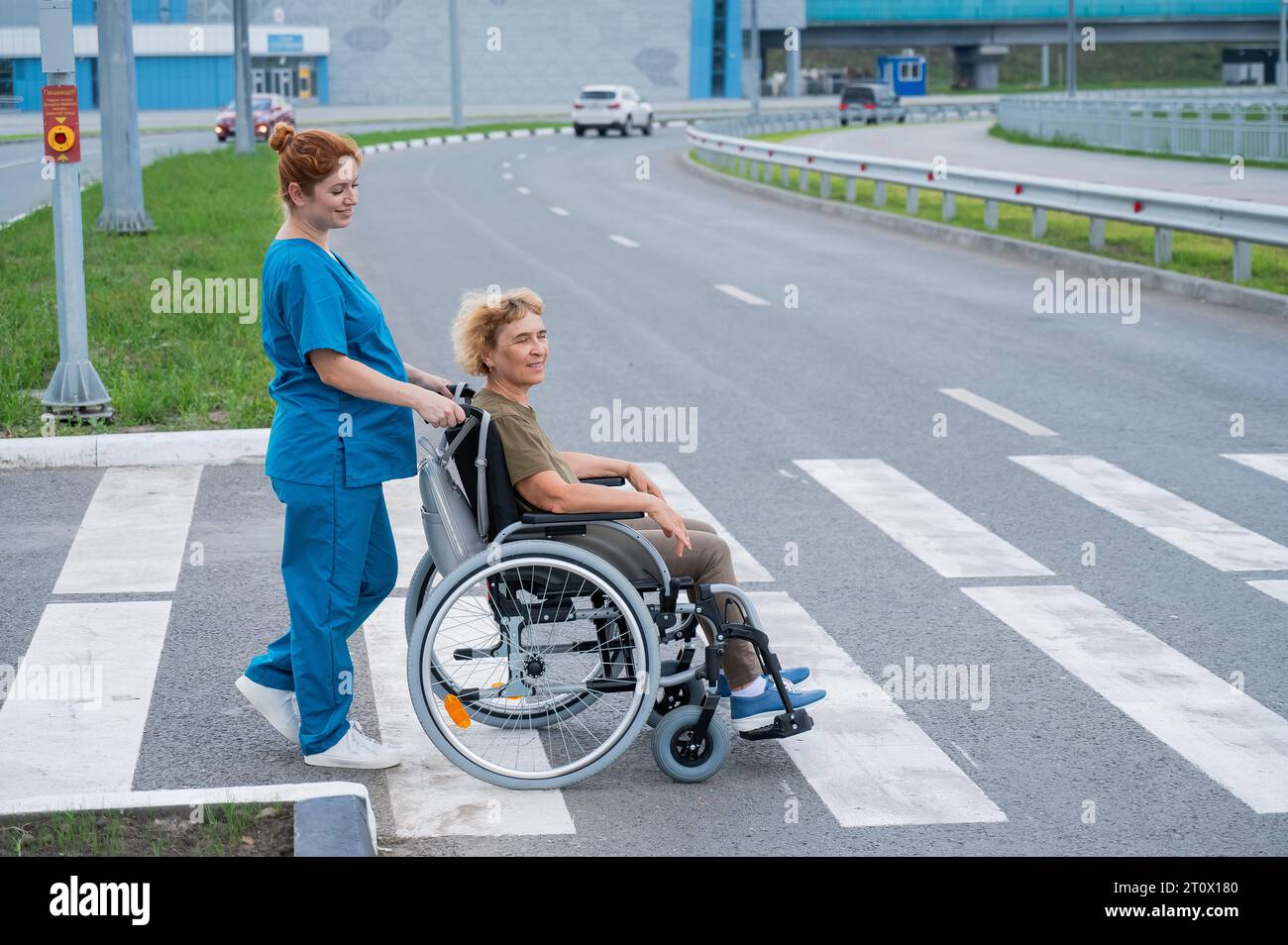 Helping old lady cross road hi-res stock photography and images - Alamy