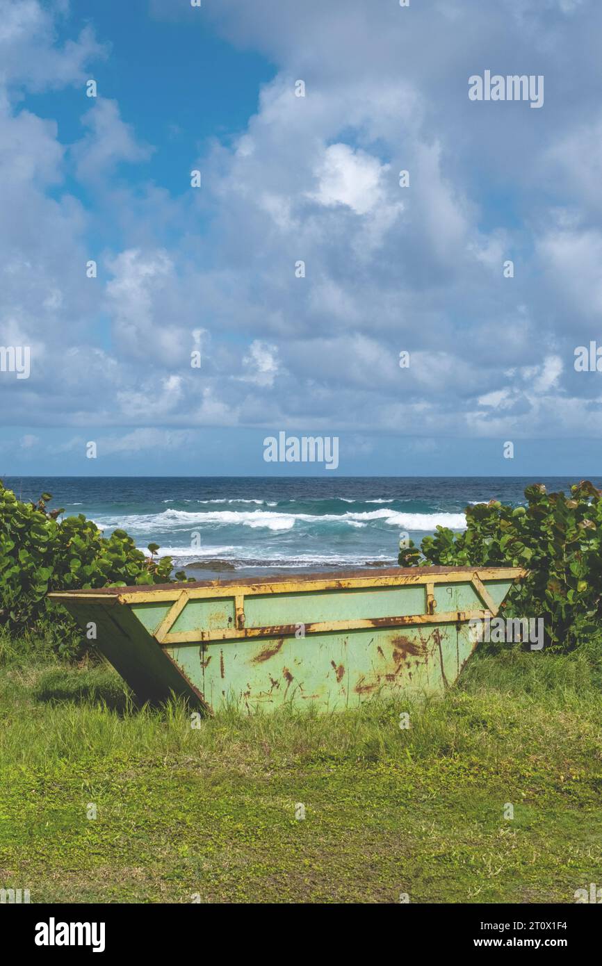 Rubbish Skip on the Barbados East Coast showing the sea Stock Photo - Alamy