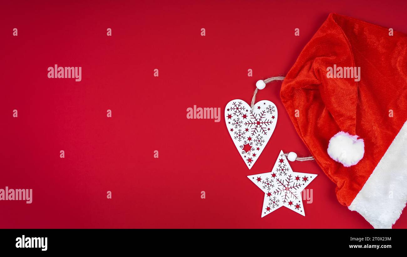 Red Santa Claus hat, Christmas decor on red surface. Christmas ...