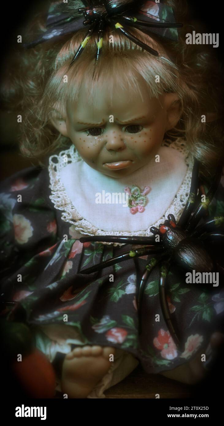 Baby doll with spiders on it Stock Photo - Alamy