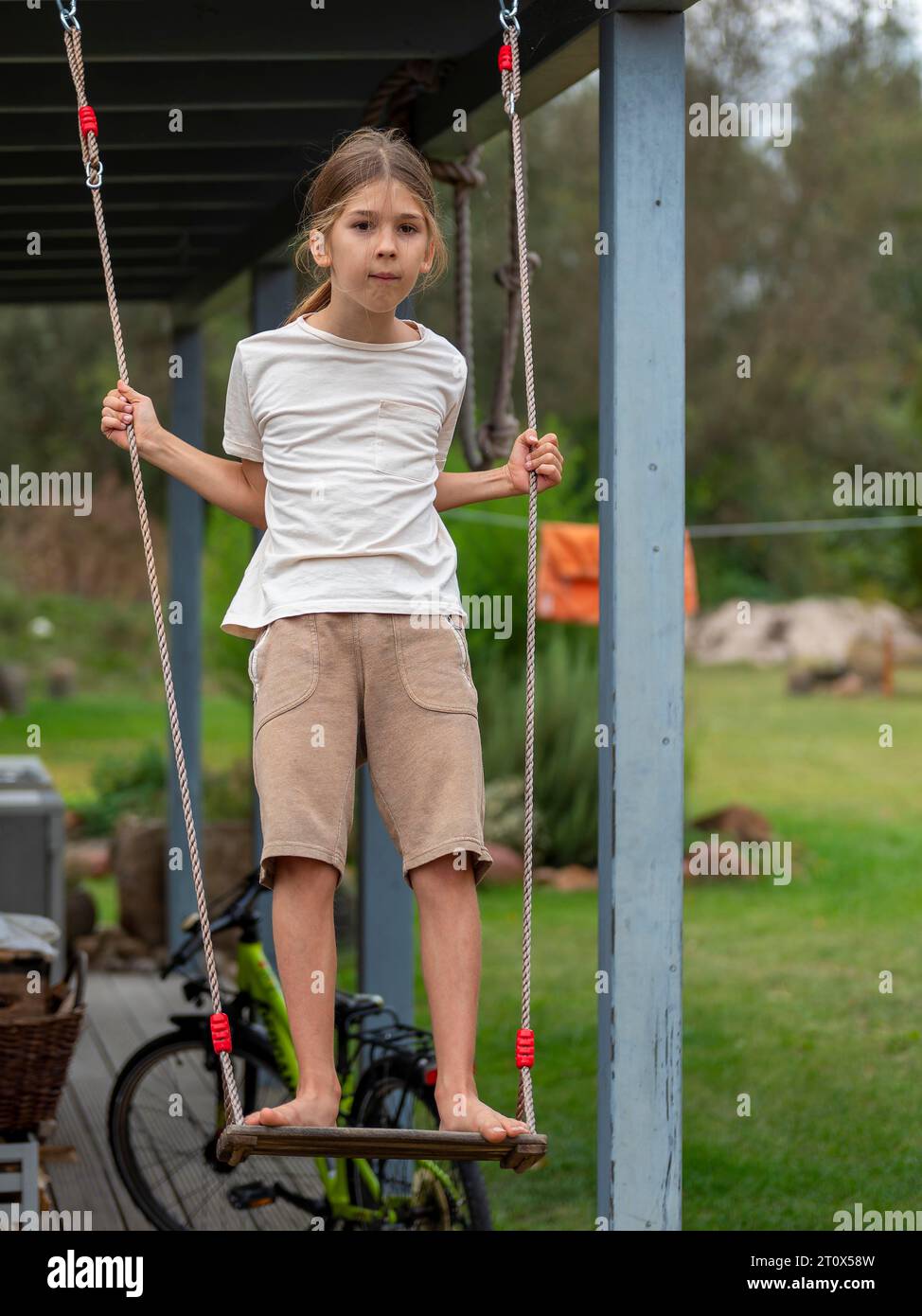 Boy standing swing hi-res stock photography and images - Alamy