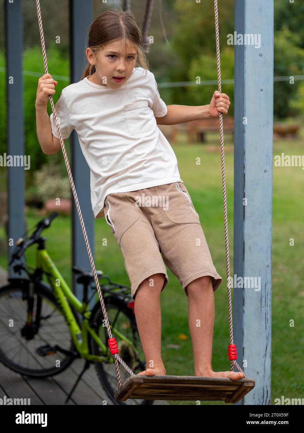 Boy standing swing hi-res stock photography and images - Alamy