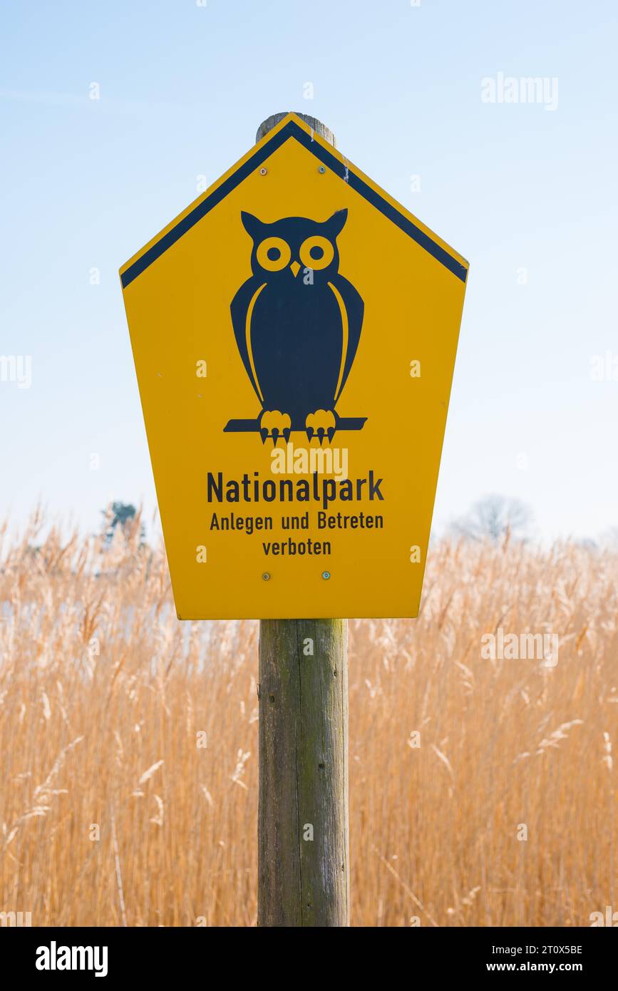 Yellow-black sign National Park with owl symbol, lettering Anlegen und ...