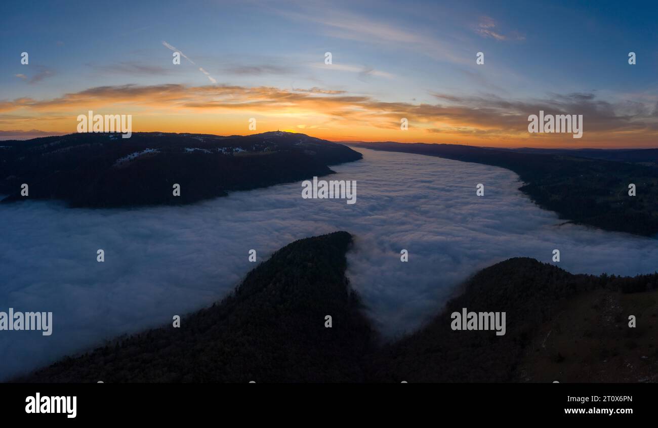 Aerial view of the sea of fog over the Vallon de Saint-Imier with a ...
