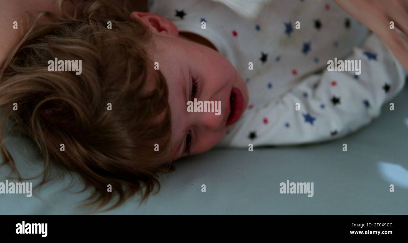 Angry baby not wanting to brush teeth, upset infant boy showing ...