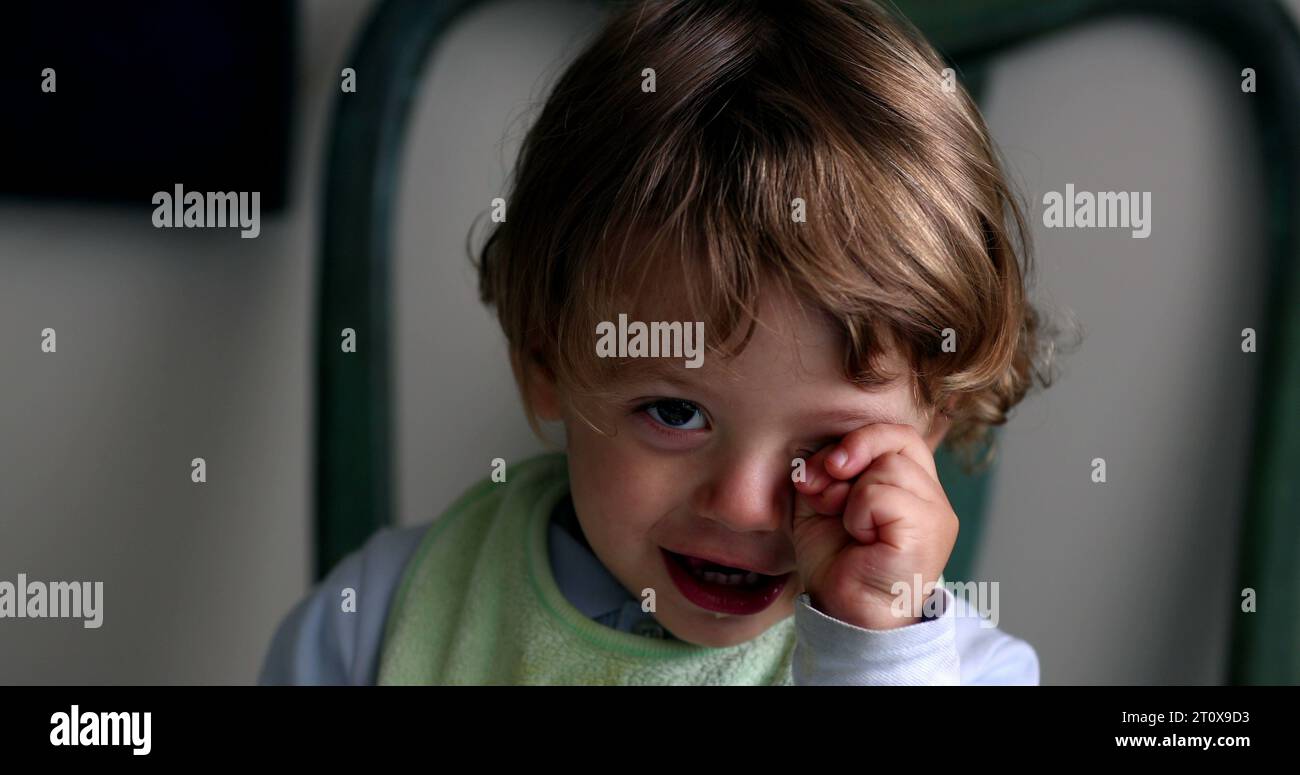 Baby boy rubbing eyes hi-res stock photography and images - Alamy