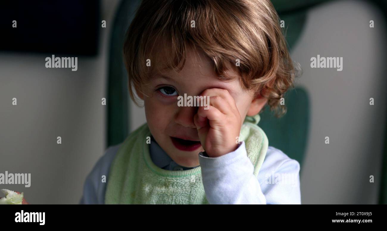Baby boy rubbing eyes hi-res stock photography and images - Alamy