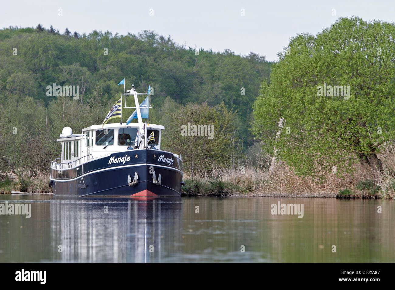 Residential boat on the Peene, Peene Valley River Landscape nature park ...