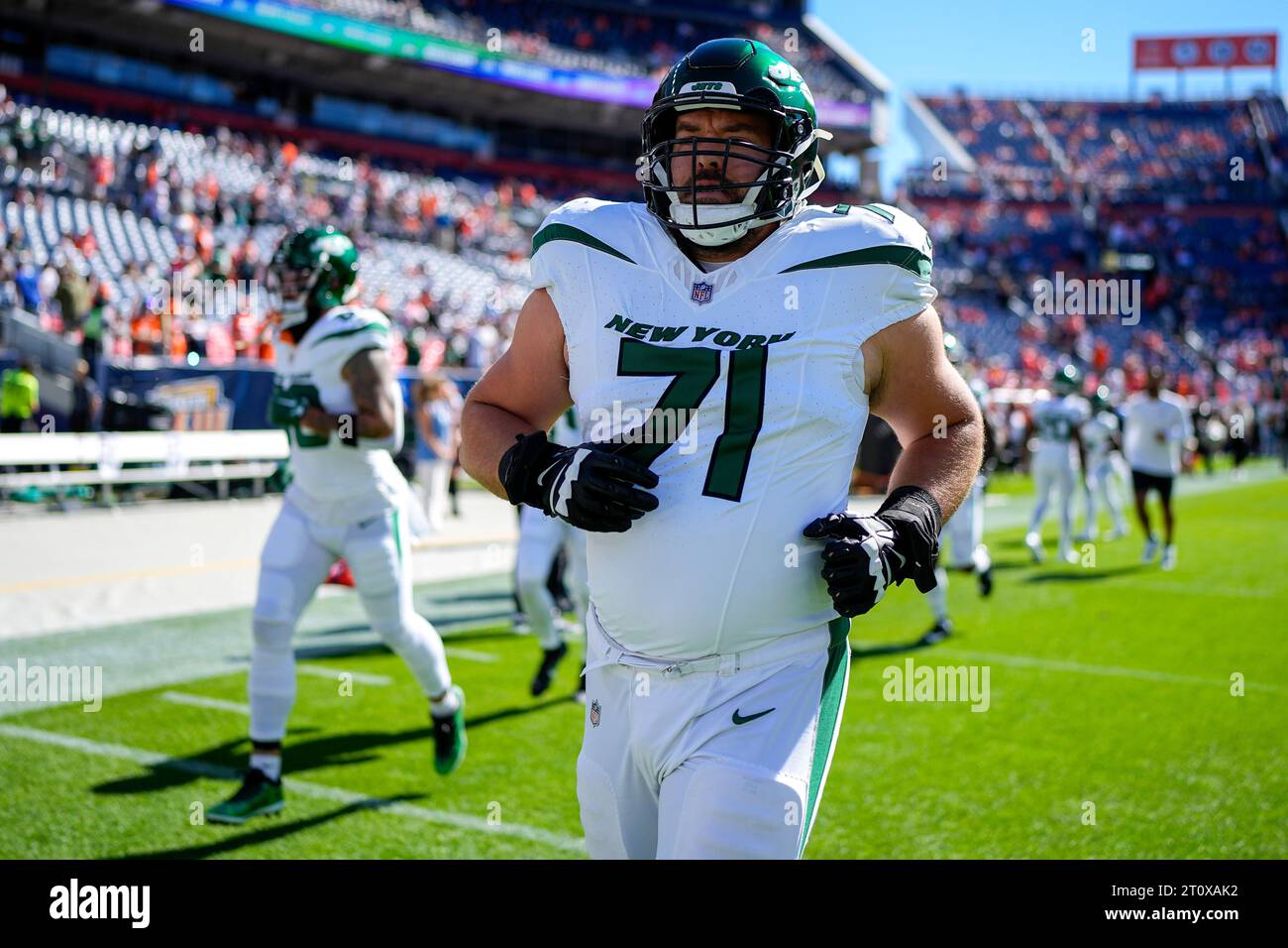 New York Jets guard Wes Schweitzer takes the field against the Denver ...