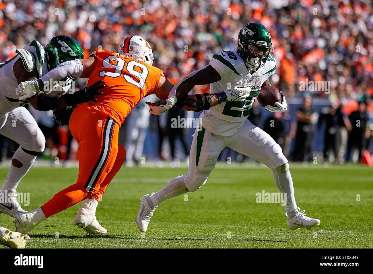 New York Jets running back Breece Hall (20) rushes against Denver ...