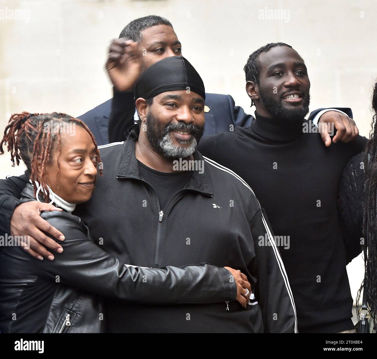 Boxing trainer Brian McIntyre (centre) leaves Manchester Crown Court ...