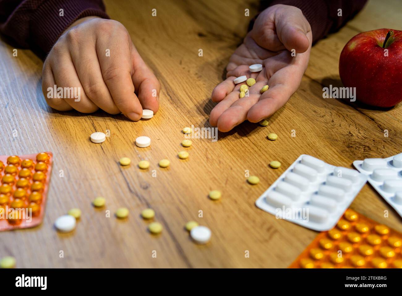 hand making happy face out of pills on the table drugs addiction ...