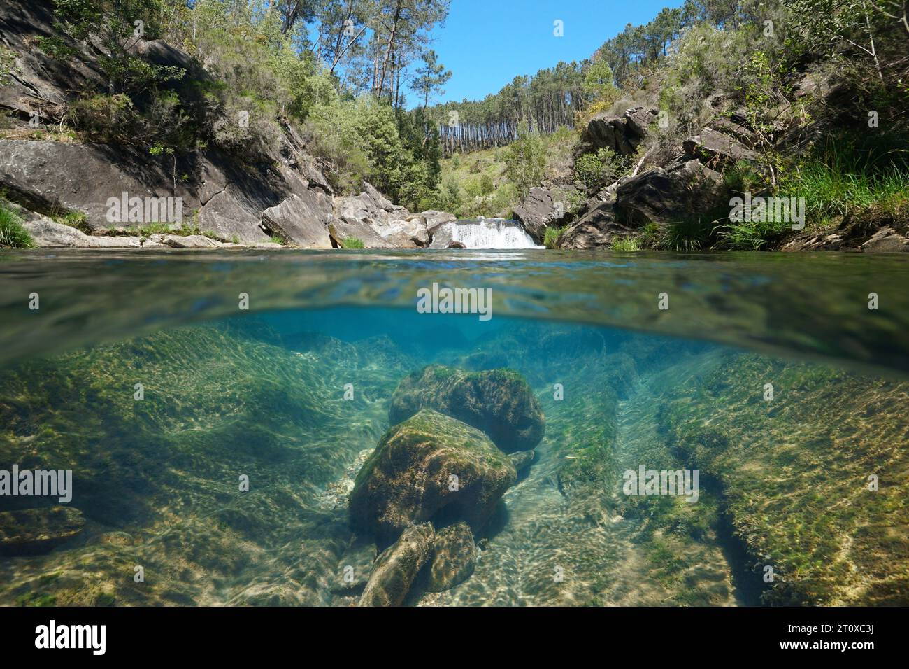 Waterfall on a wild river with clear water, natural scene, split level ...