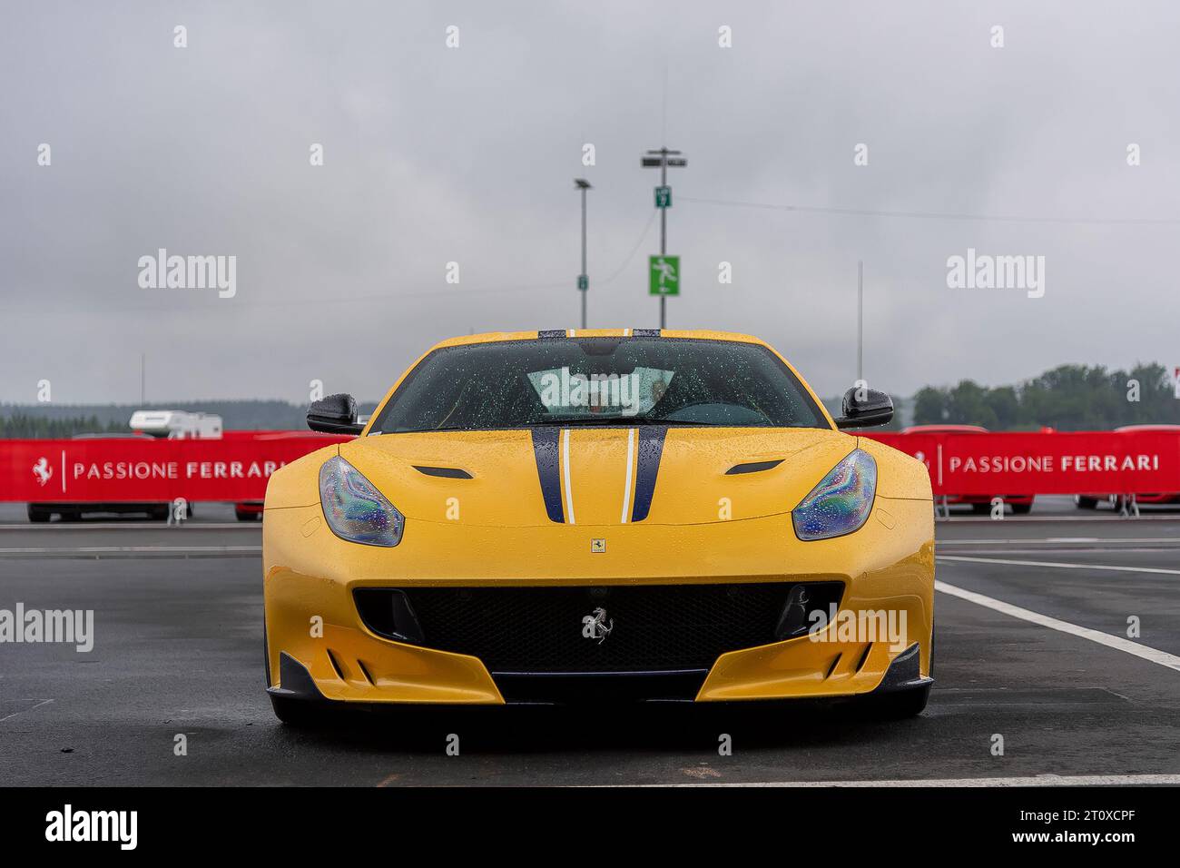 Yellow Ferrari F12tdf parked on the Nürburgring track Stock Photo - Alamy